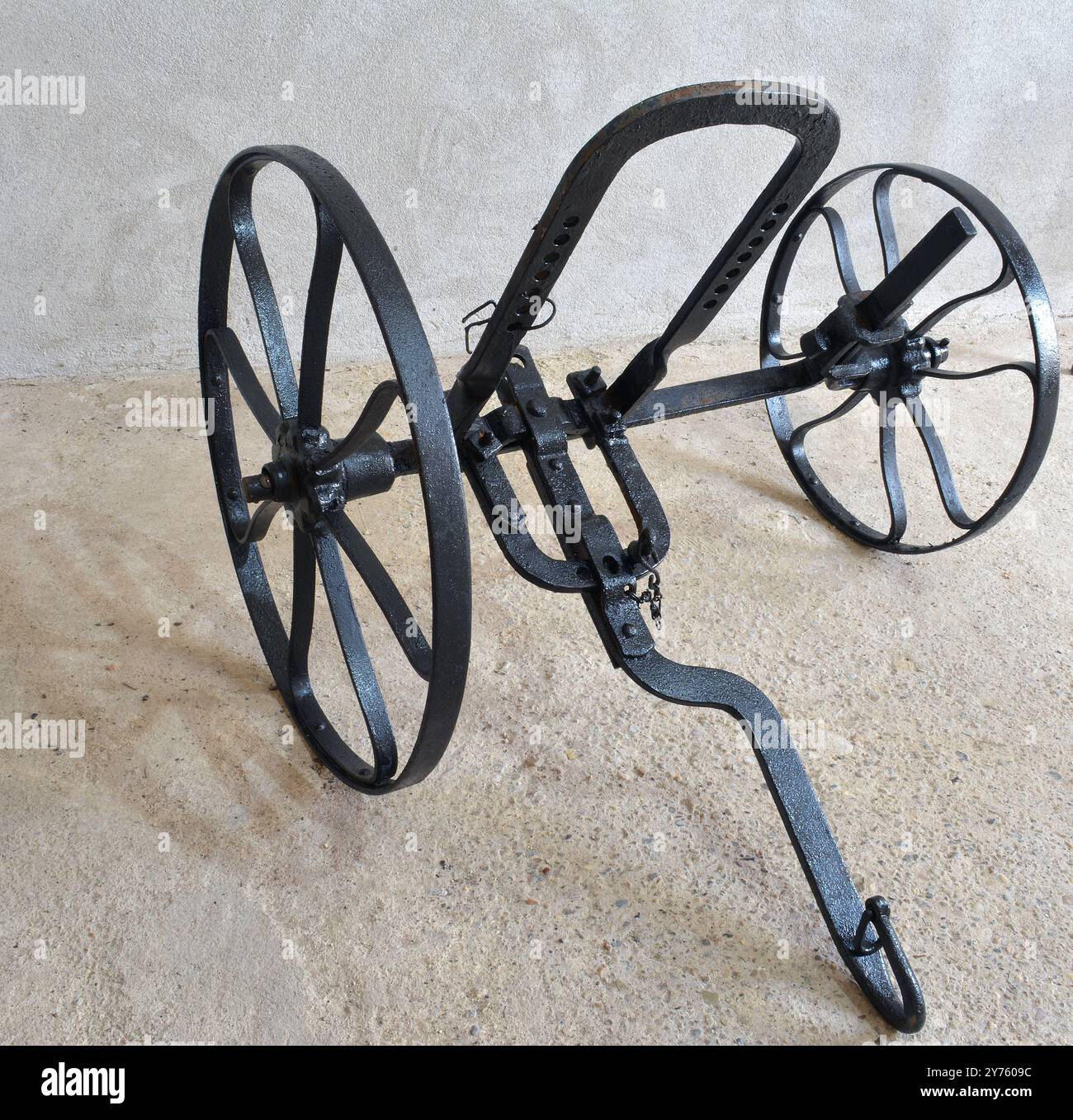 Ancient black iron plow tool used in farming for cultivation of soil in ...