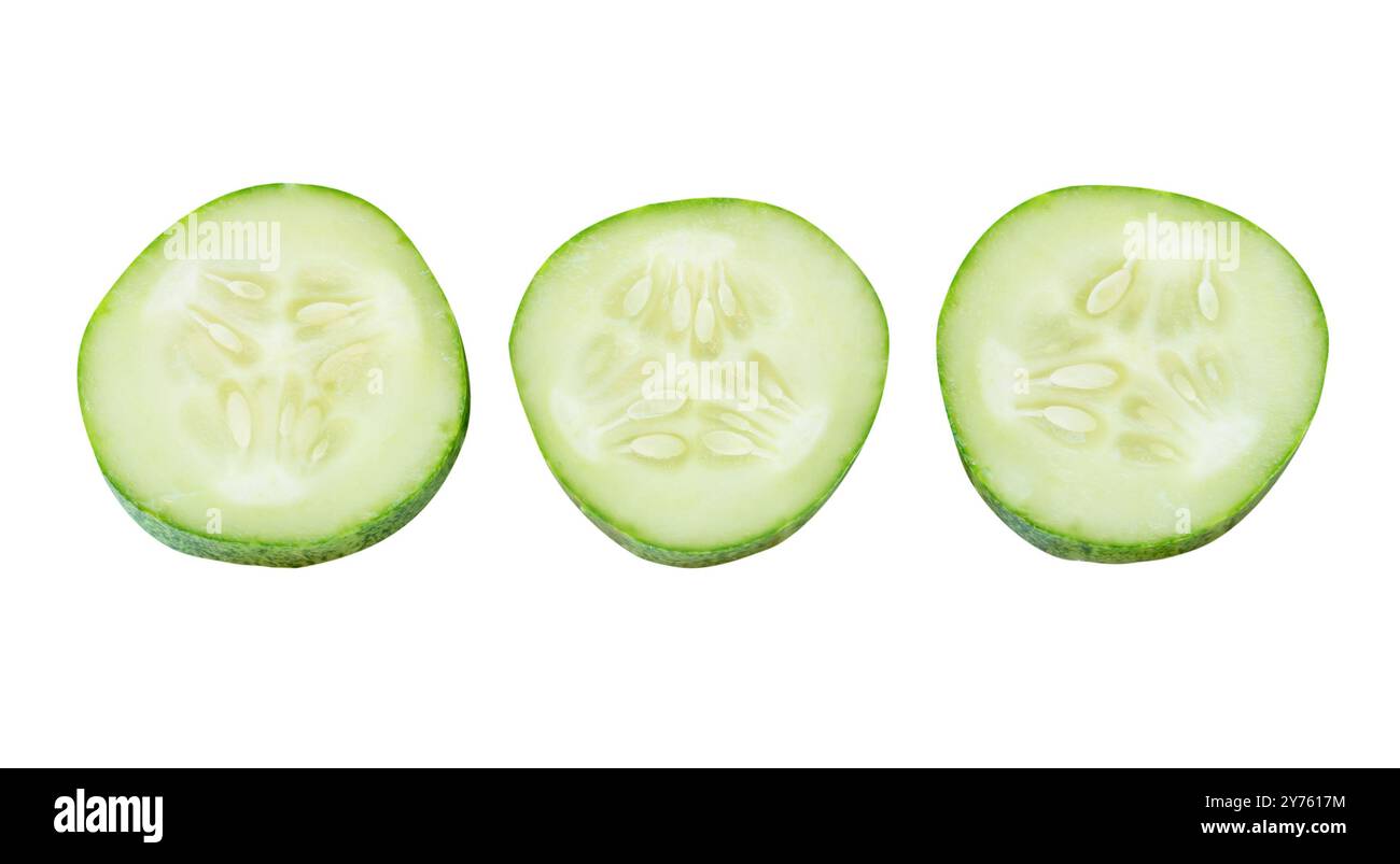 Top view set of fresh green cucumber slices in circle shape is isolated ...