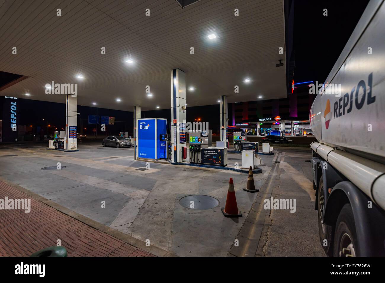 Tanker truck from the Repsol company unloading at a service station at ...