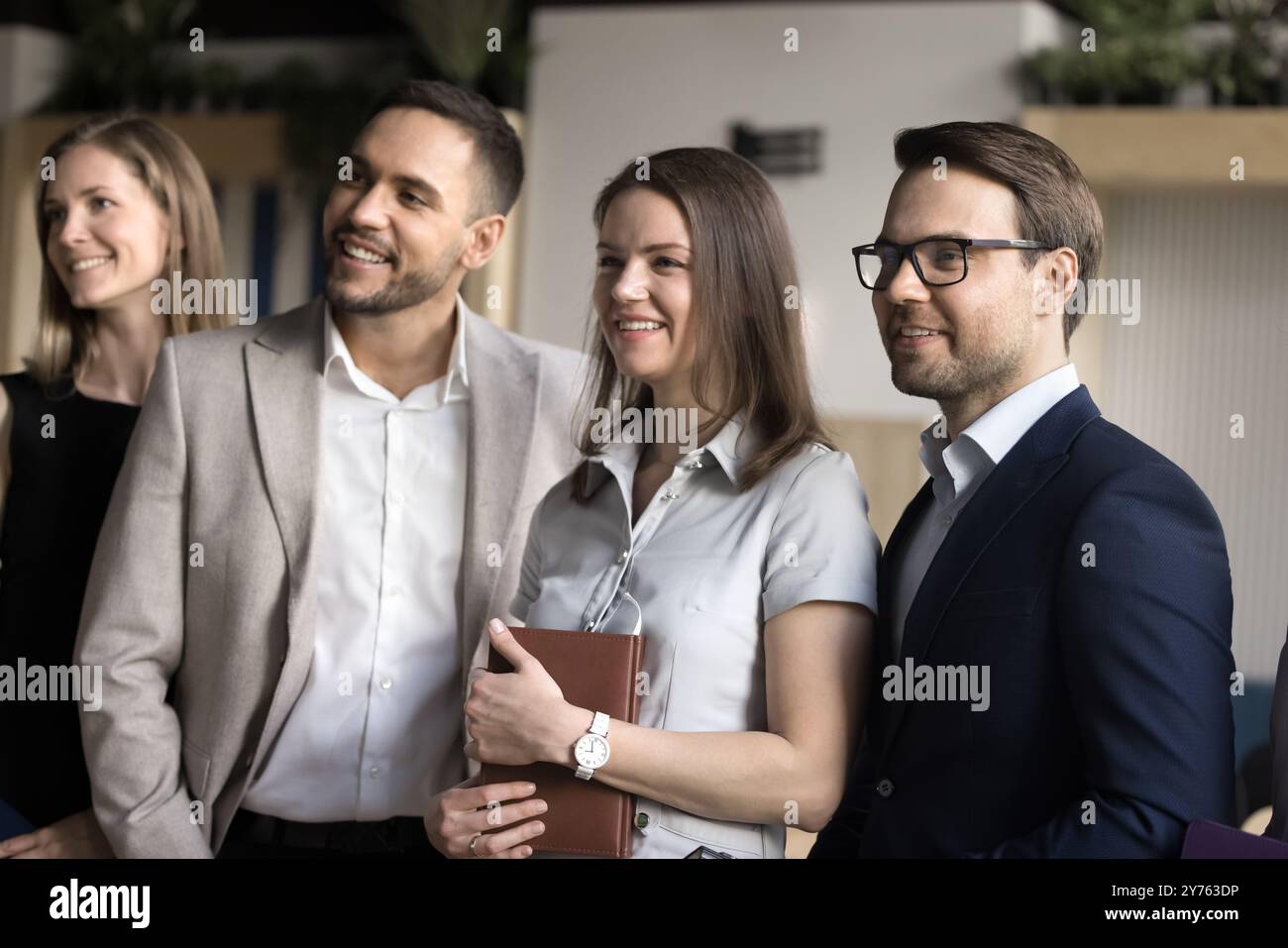 Group happy employees standing hi-res stock photography and images - Alamy