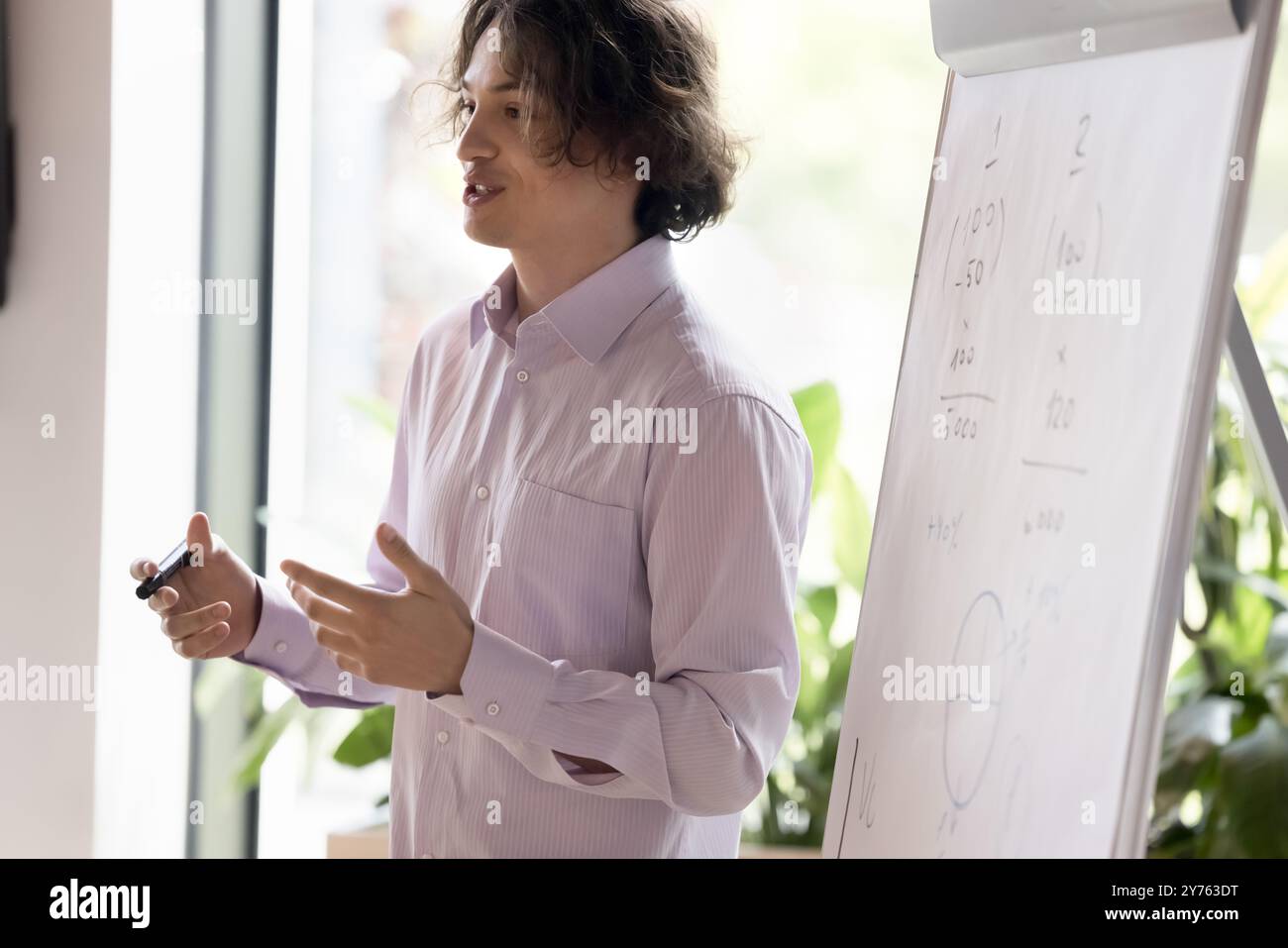 Happy motivated business project leader man speaking at flipchart Stock ...