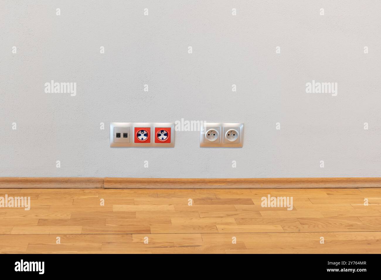 Multiple power sockets on a white grey wall modern contemporary ...