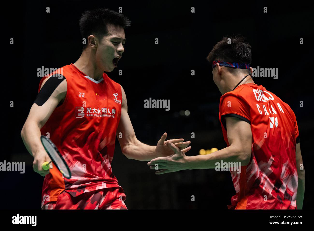 Macao, China. 28th Sep, 2024. Chen Xujun/Liu Yi (L) react during the men's doubles semifinal ...