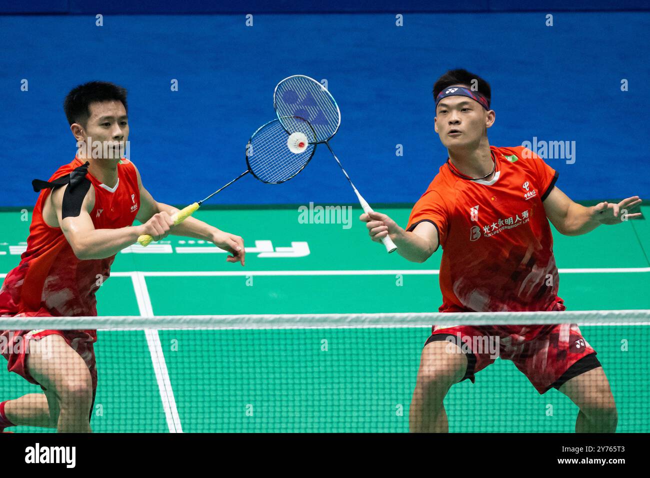 Macao, China. 28th Sep, 2024. Chen Xujun/Liu Yi (L) compete during the men's doubles semifinal ...