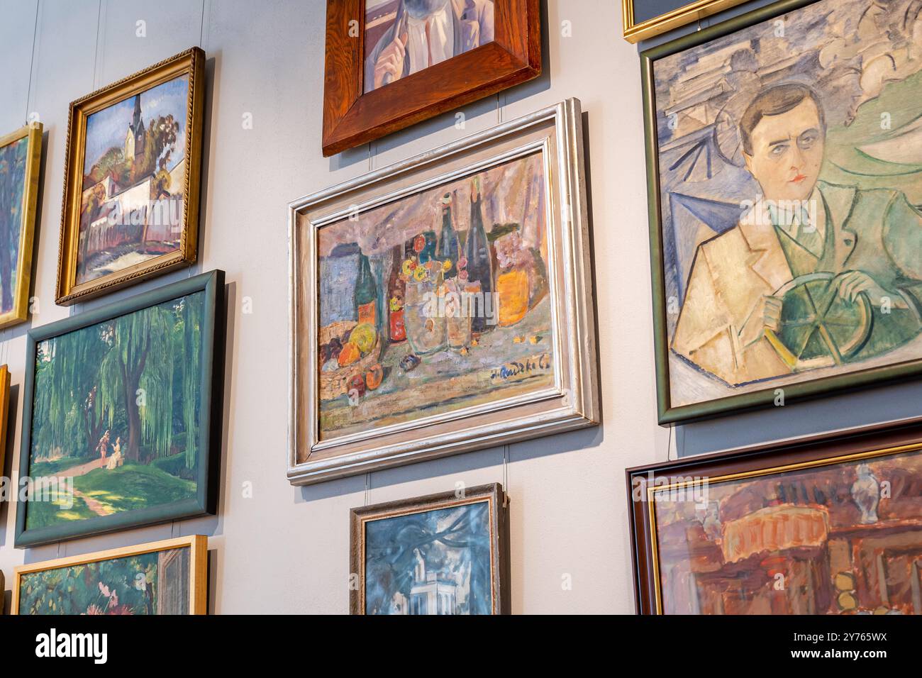 Different old antique paintings on an art museum wall, cultural ...