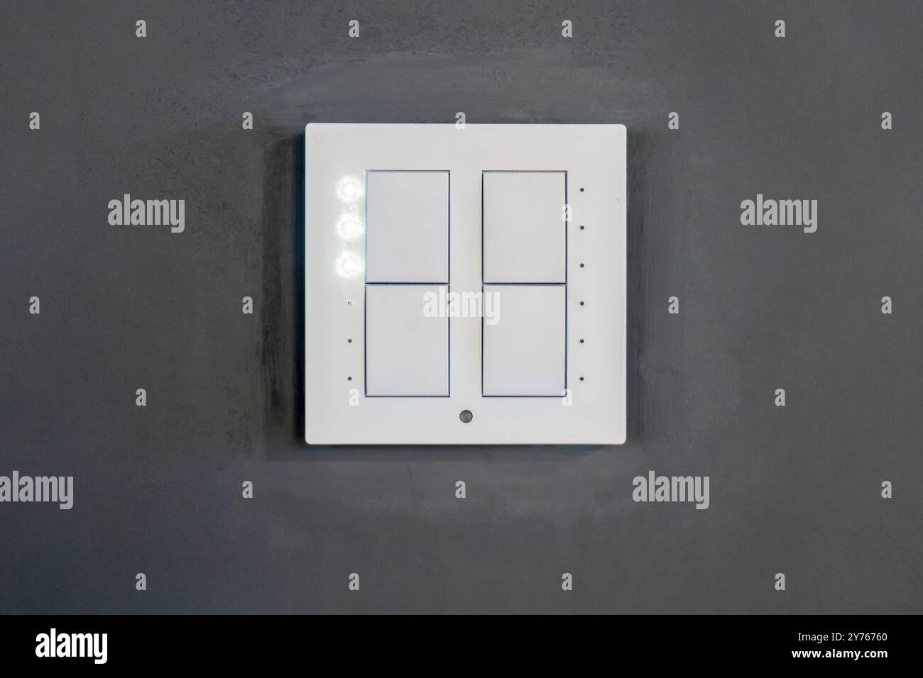 4 button white modern smart light scene switch on a grey wall, object ...