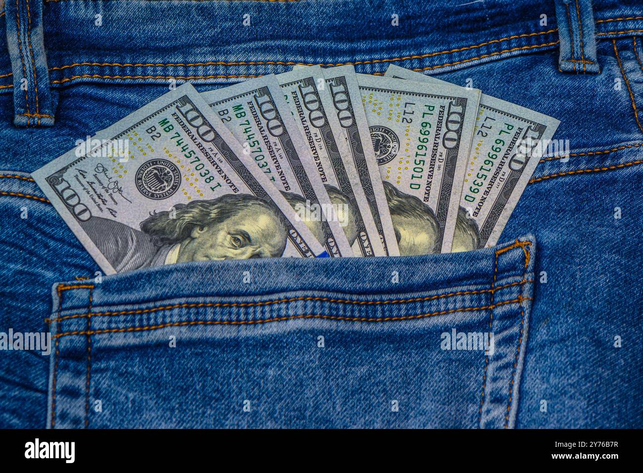 One Hundred Dollar Bills in Jean Pockets Stock Photo - Alamy