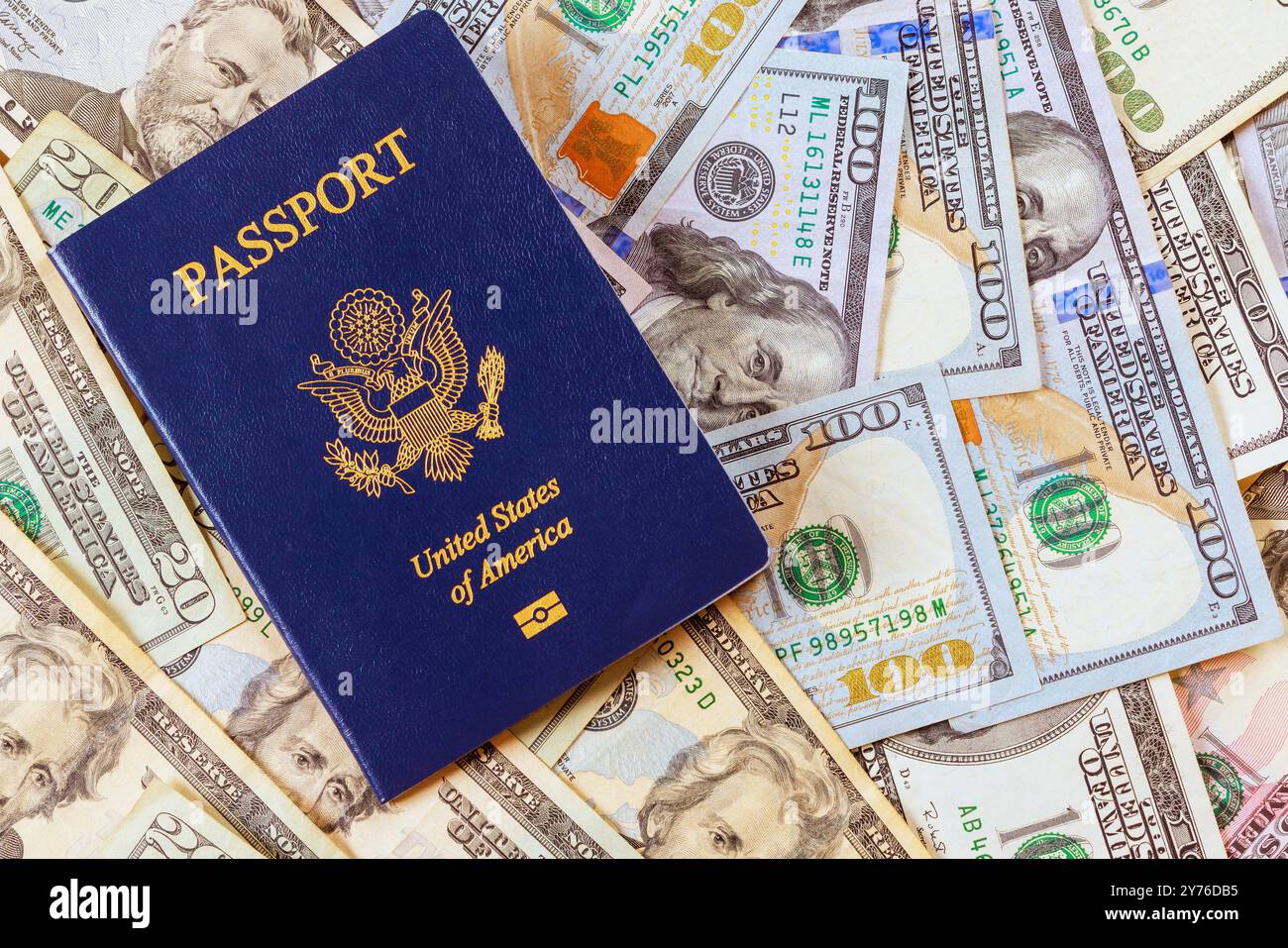 There is nominal difference between US passport on top of US currency ...