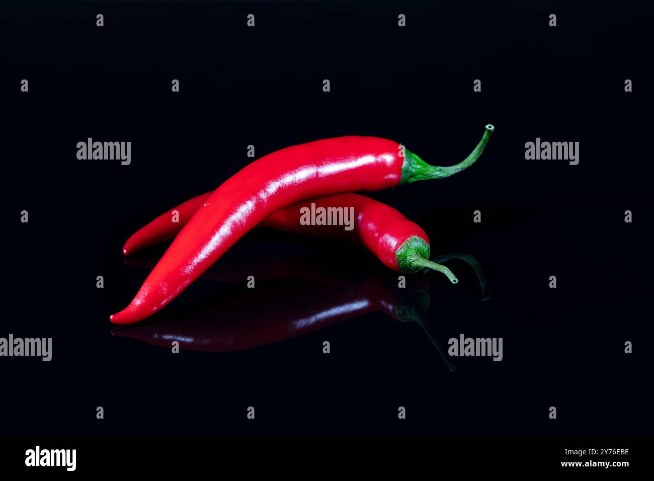 chilies with black background Stock Photo - Alamy