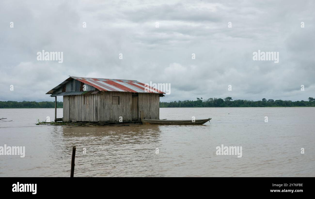 Floating house on Amazon river Stock Photo - Alamy