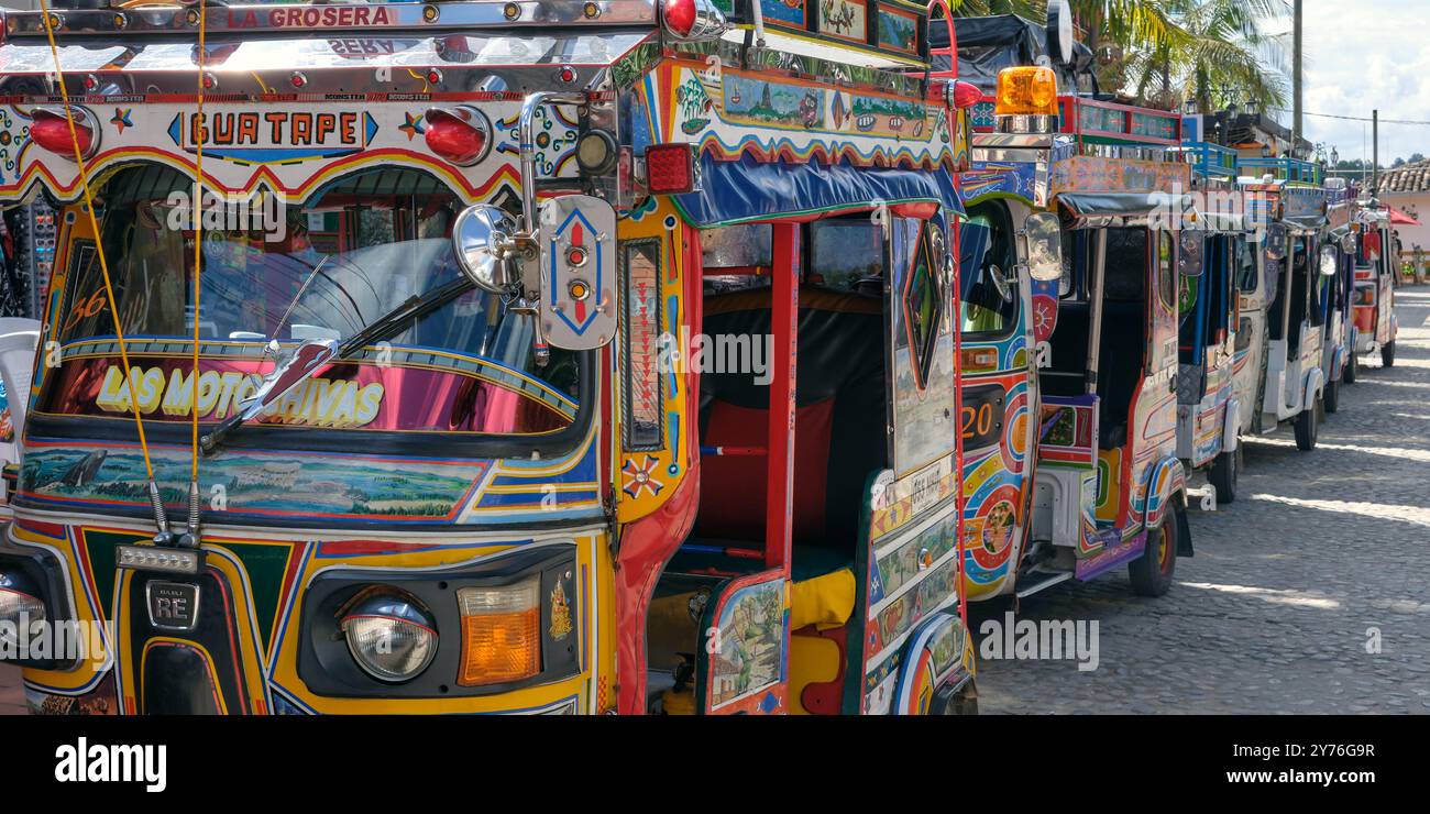 tuk tuk parked in main square of Guatape, Colombia Stock Photo - Alamy