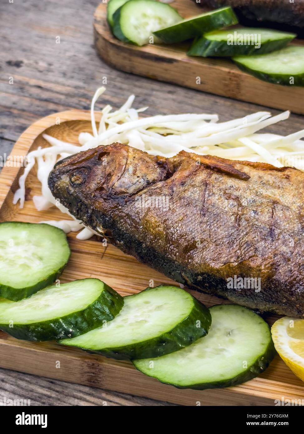 Grilled Fish with Fresh Vegetables Stock Photo - Alamy