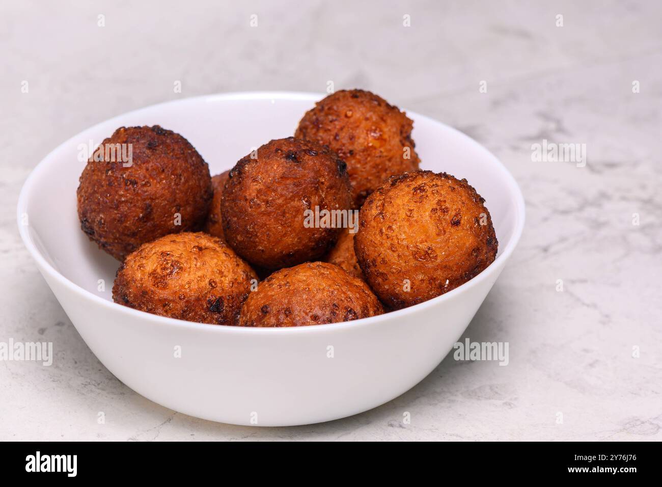 Bowl with delicious fried tofu balls on white background Stock Photo ...