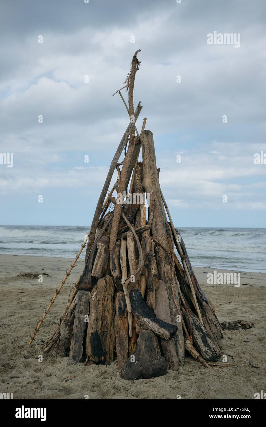 Driftwood teepee structure on Mendihuaca beach, Colombia Stock Photo ...