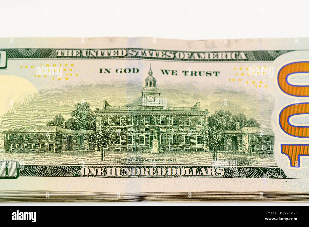 Dollars pack isolated on white background. Several 100 dollar bills are ...