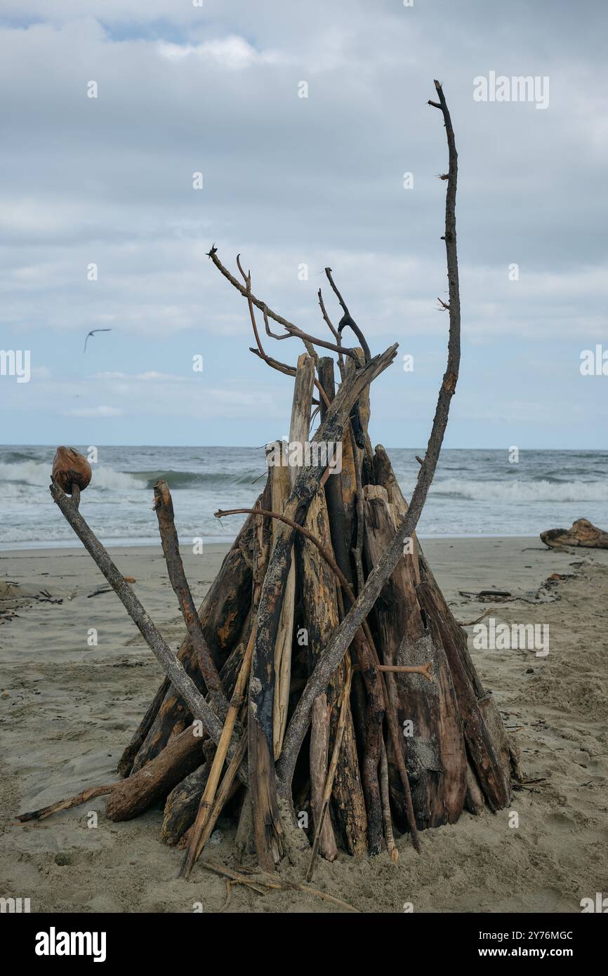 Driftwood teepee structure on Mendihuaca beach, Colombia Stock Photo ...