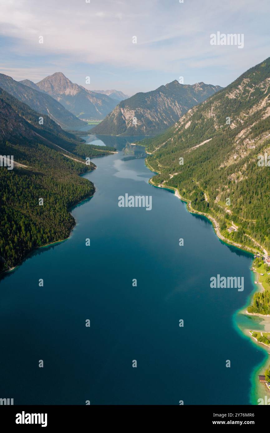A mesmerizing panorama of Plansee Lake showcases vibrant turquoise ...