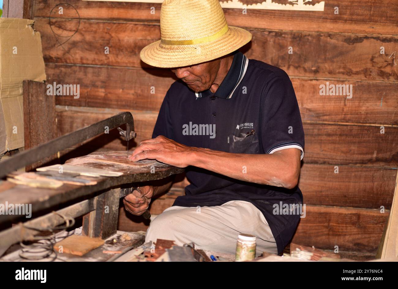 Ambositra city. Zafimaniry artisan working wood (marquetry). Amoron'i ...