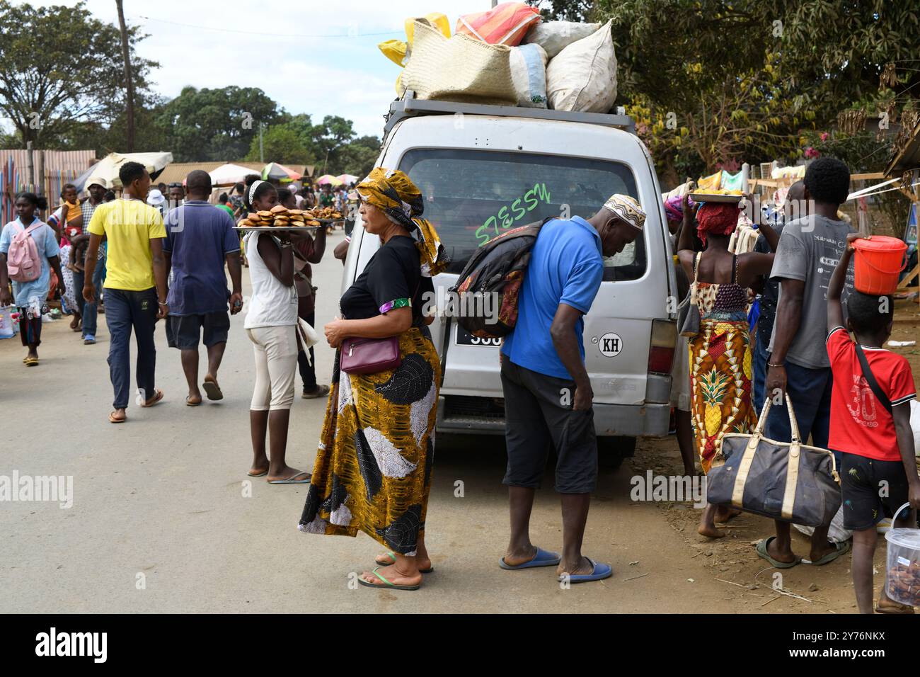Diana region, street market. People with traditional and occidental ...