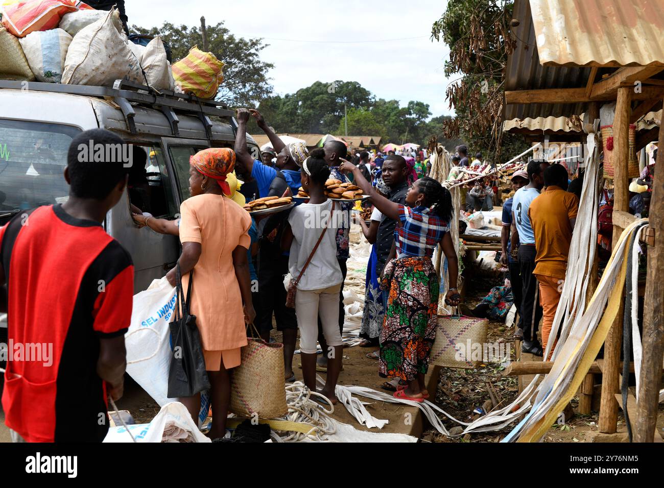 Diana region, street market. People with traditional and occidental ...
