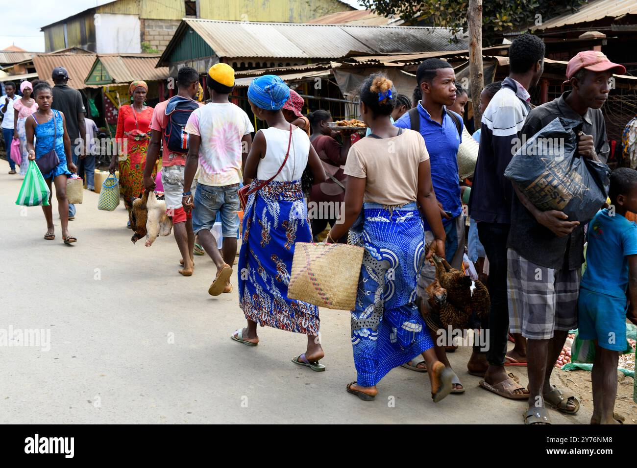 Diana region, street market. People with traditional and occidental ...