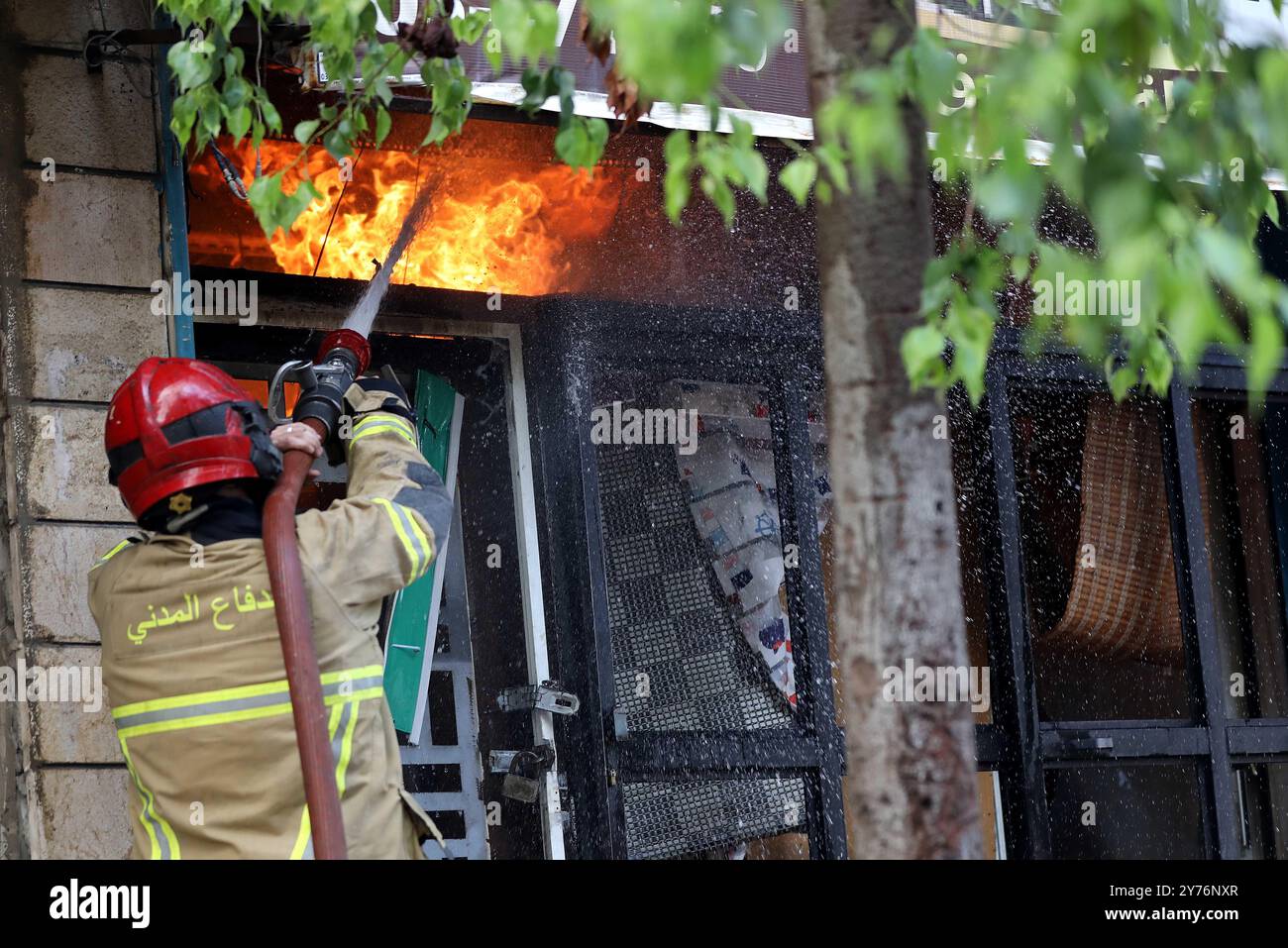 Firefighter tries extinguish fire hi-res stock photography and images ...
