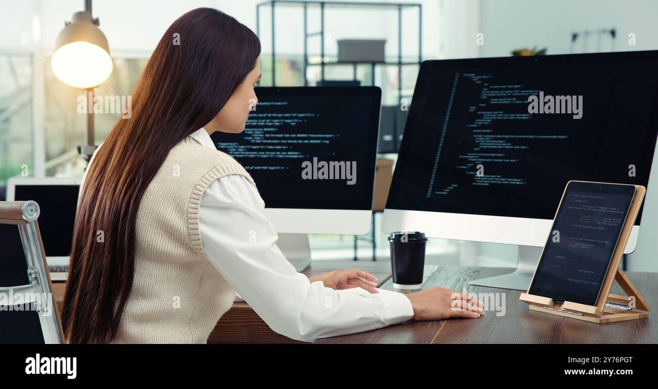 Programmer working at desk in modern office. Banner design Stock Photo ...