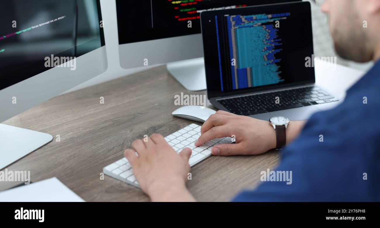 Programmer working with computer at desk in office, closeup. Banner ...