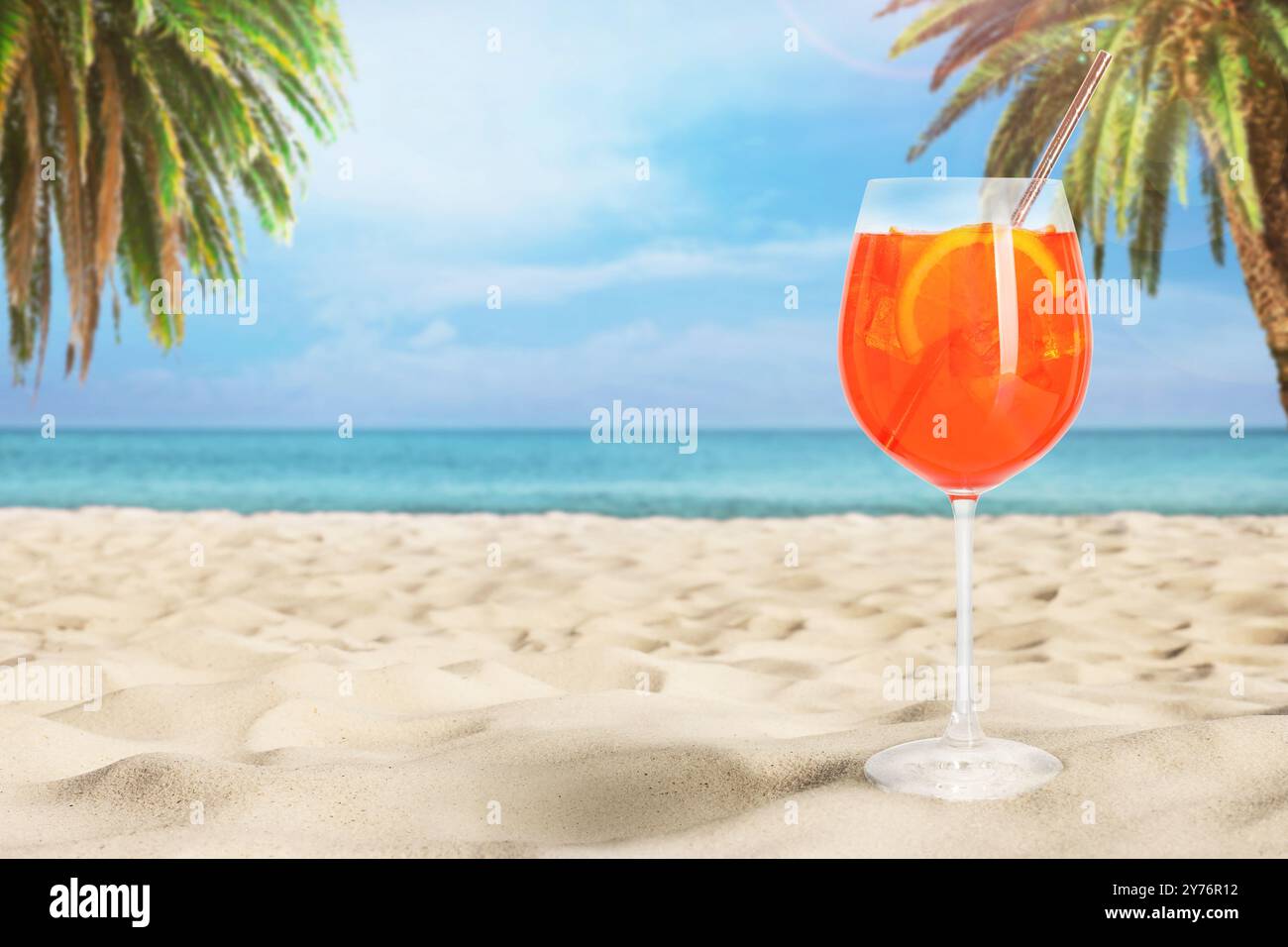 Summer beach with delicious Aperol Spritz cocktail, palm trees and ...