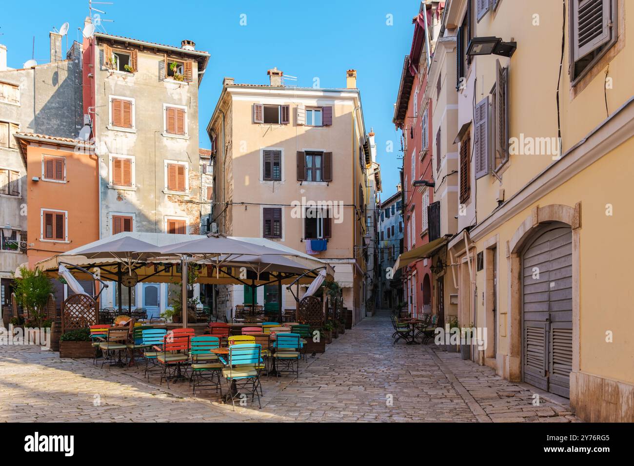 Picturesque outdoor cafe in rovinj invites visitors with colorful ...