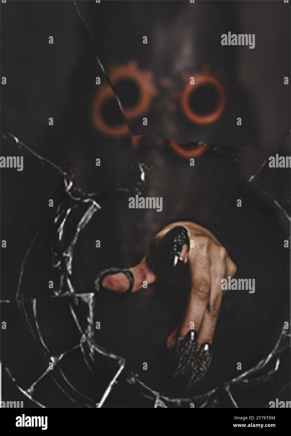 woman in plague doctor mask reaching out through broken glass Stock ...