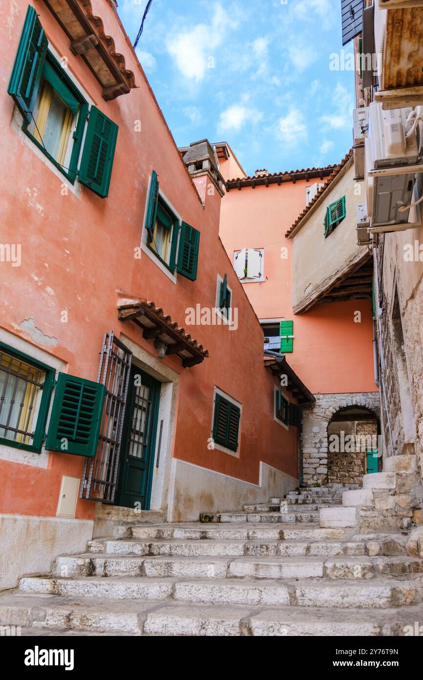 Strolling through a picturesque alleyway in Rovinj reveals colorful ...