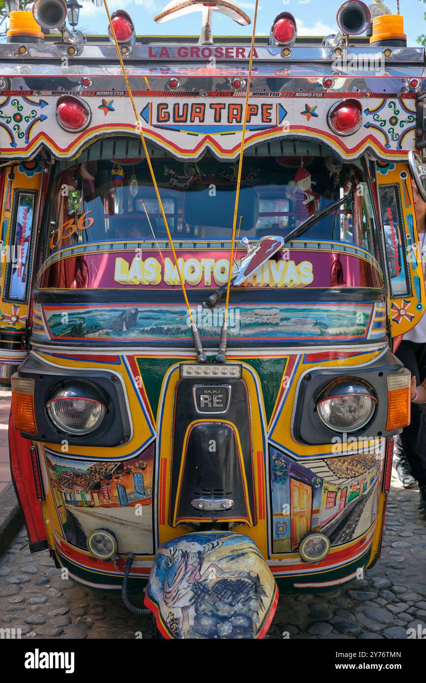 Close up of tuk tuk parked in main square of Guatape, Colombia Stock ...