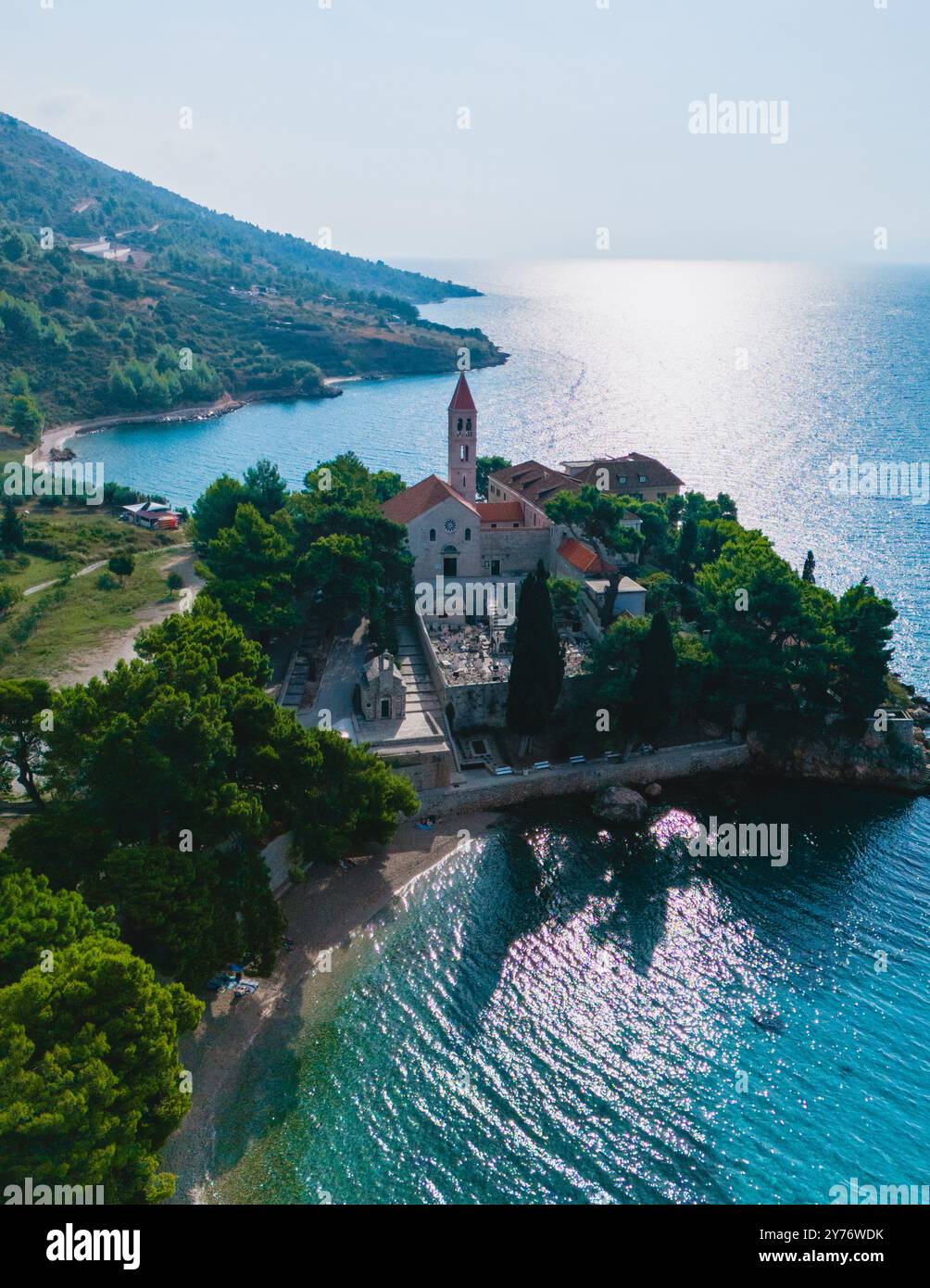 Amidst the lush greenery, a historic church stands proudly by the ...