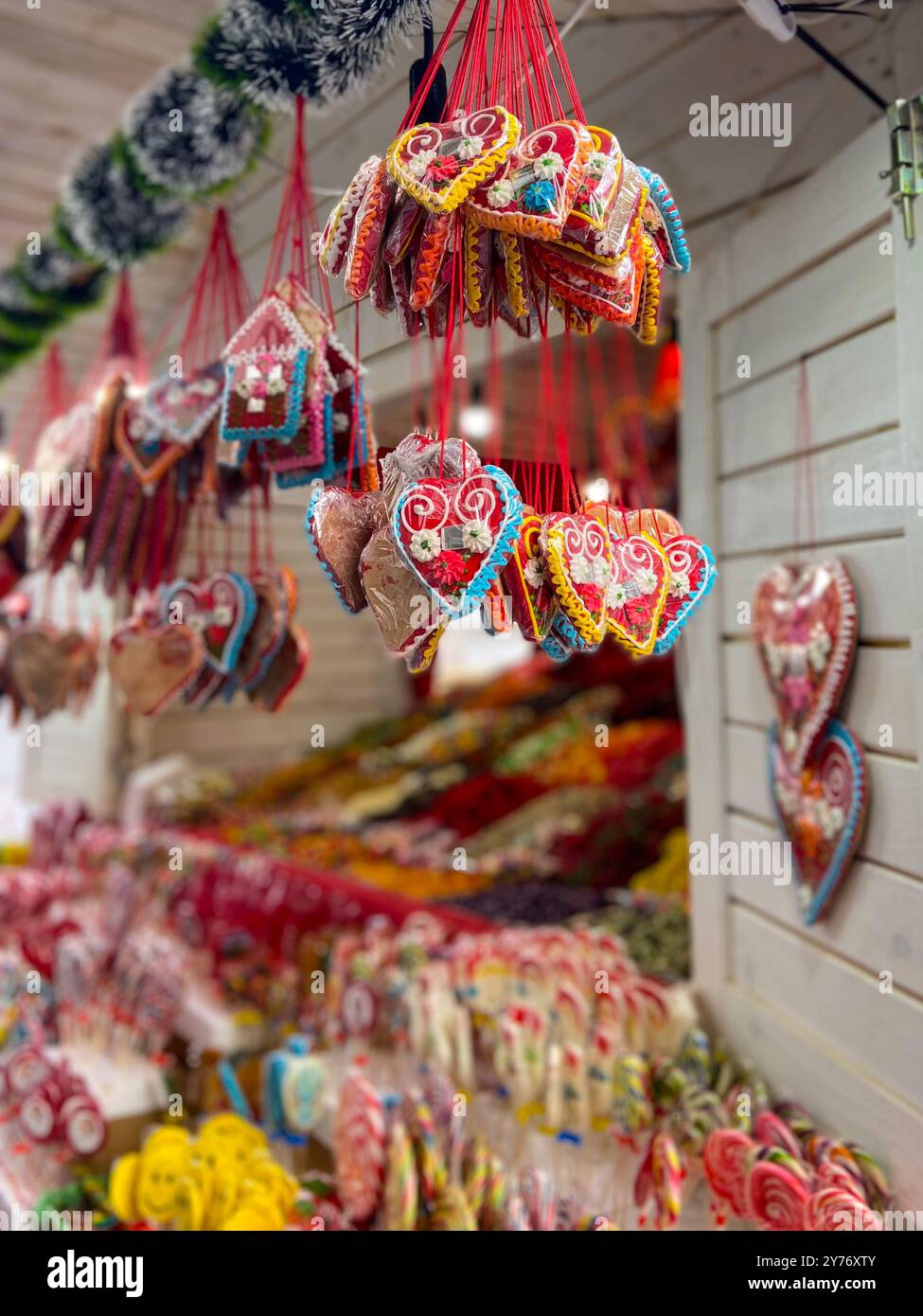 Colorful heart-shaped cookies hang elegantly on display at a festive ...