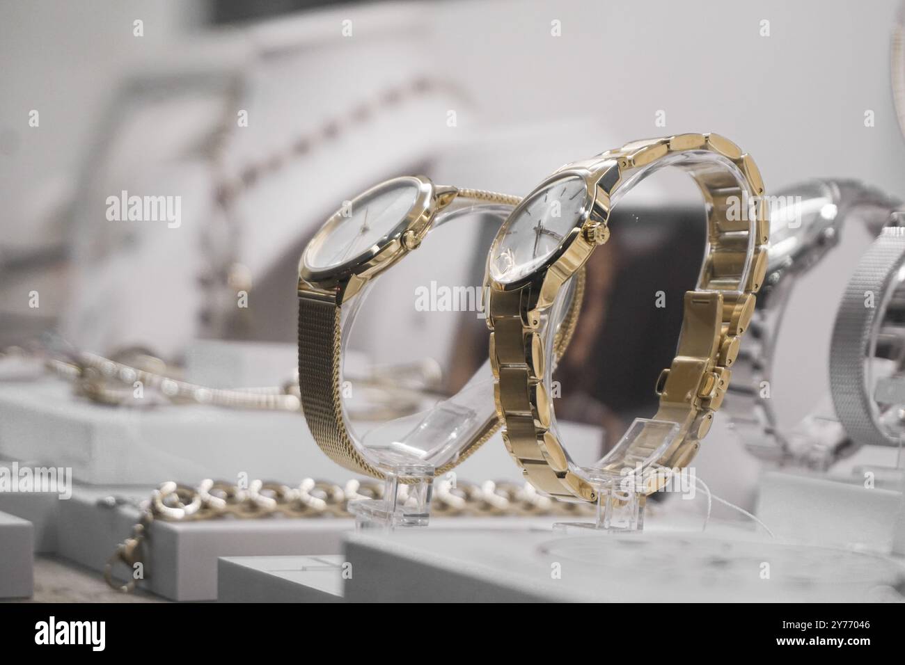 clocks on display in shop windows Stock Photo - Alamy