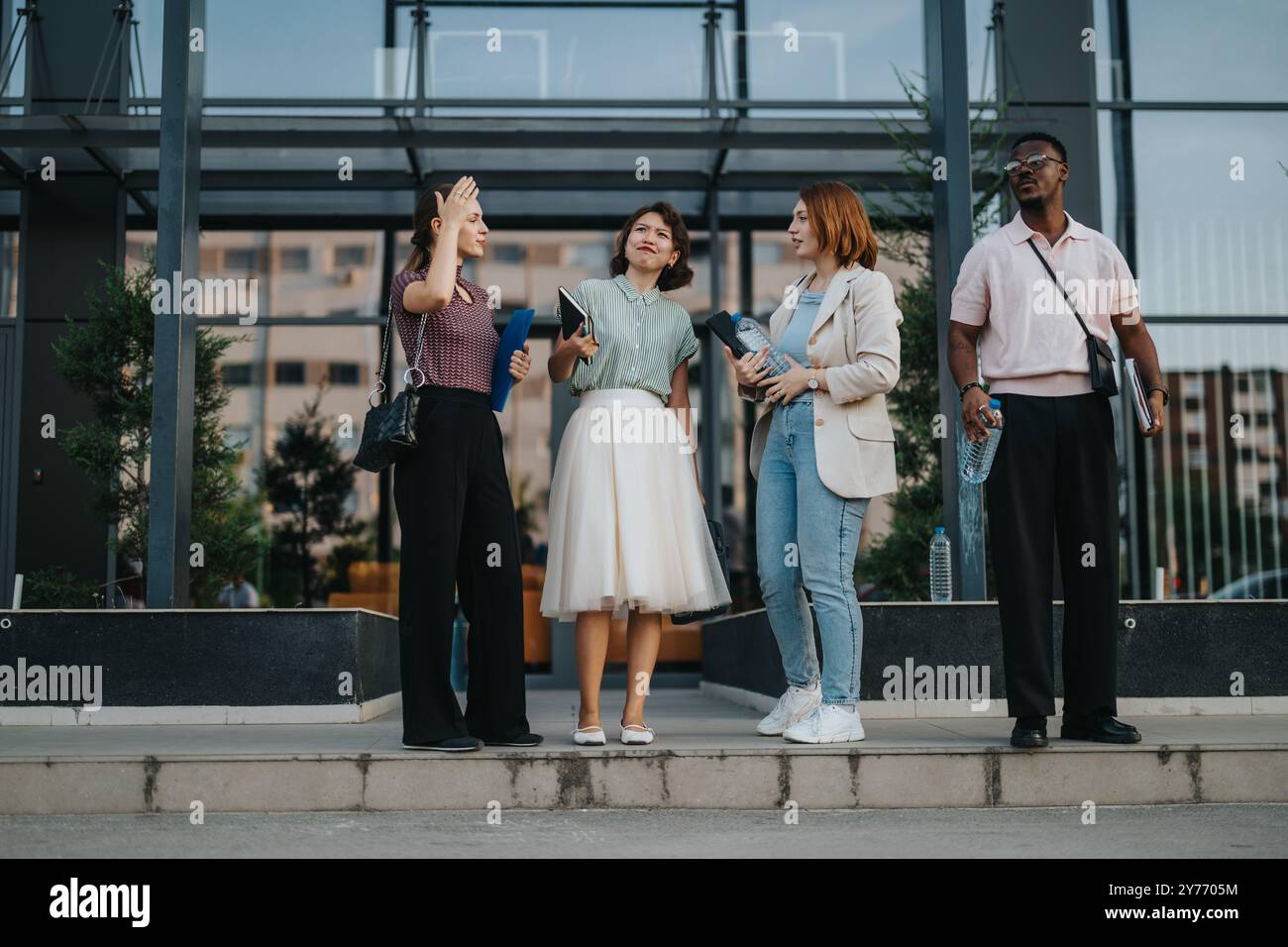 Diverse group of people having a conversation outdoors Stock Photo - Alamy