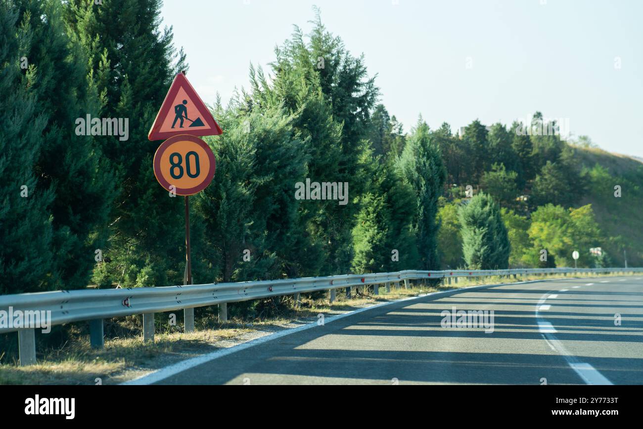 Traffic sign on highway for construction works and speed limit Stock ...