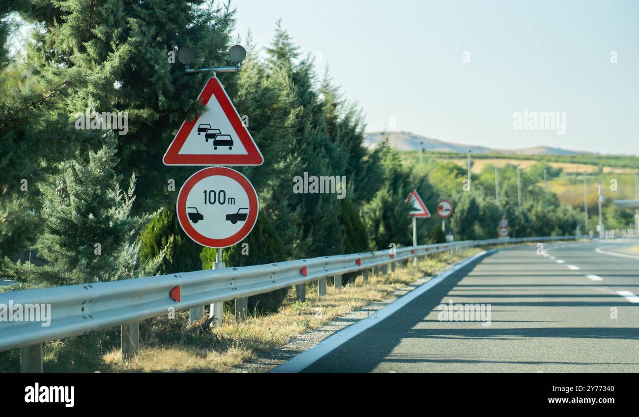 Traffic jam ahead sign and Leaving less distance than indicated ...