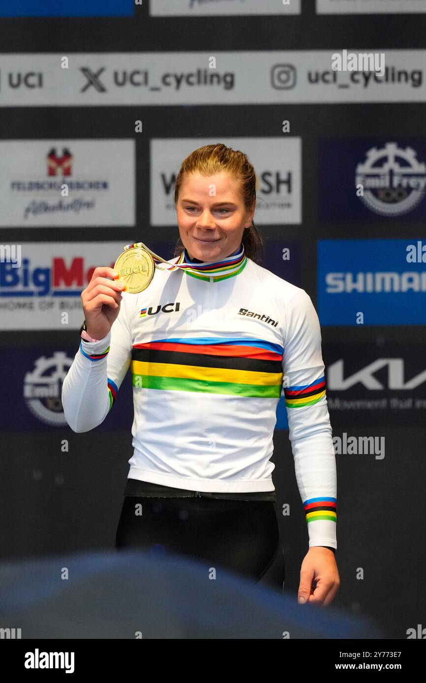 Belgium's Lotte Kopecky shows the gold medal she received for winning ...