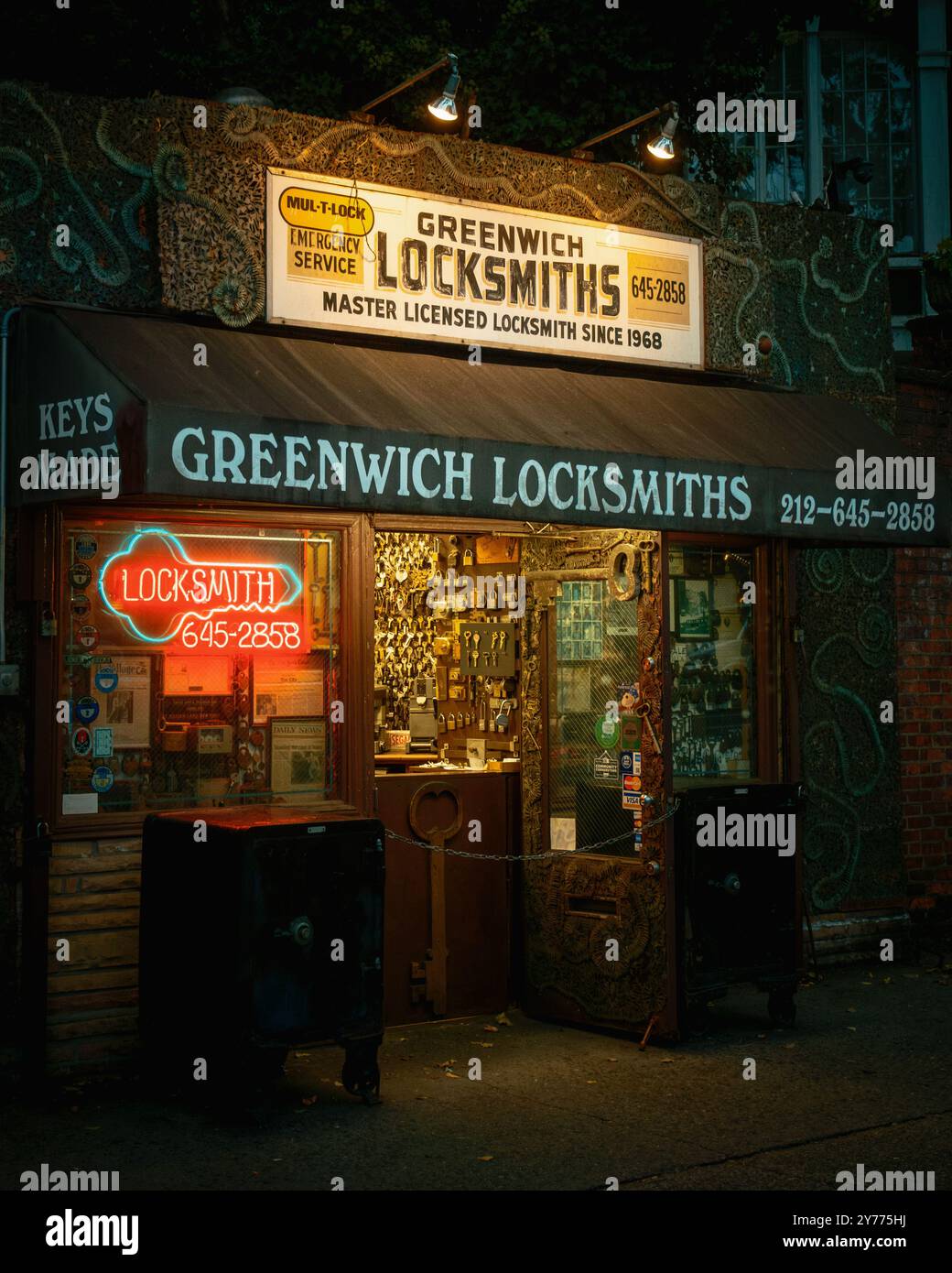 Greenwich Locksmiths storefront at night in the West Village, Manhattan ...