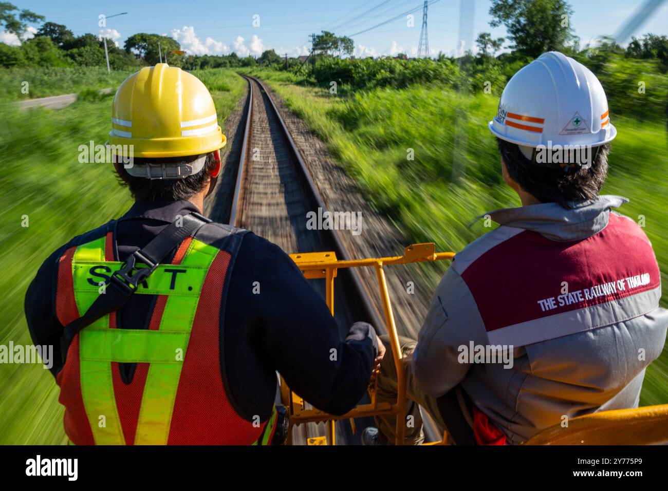Officials from the State Railway of Thailand are seated on a ...