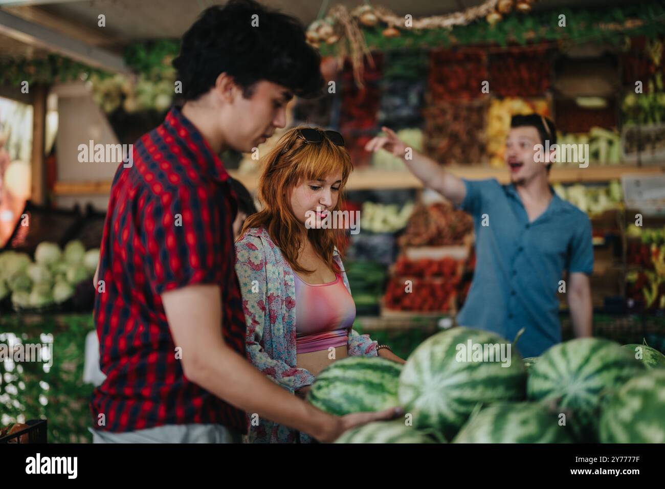 Friends shopping for fresh fruits and vegetables at a local market ...