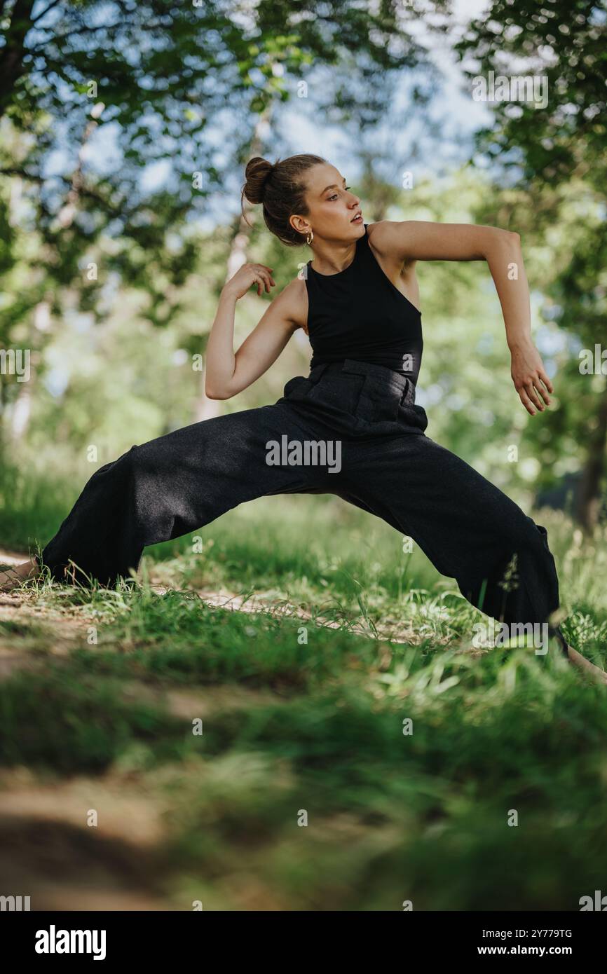 Lovely girl dancing in nature, female dancer performing modern dance outdoors Stock Photo - Alamy