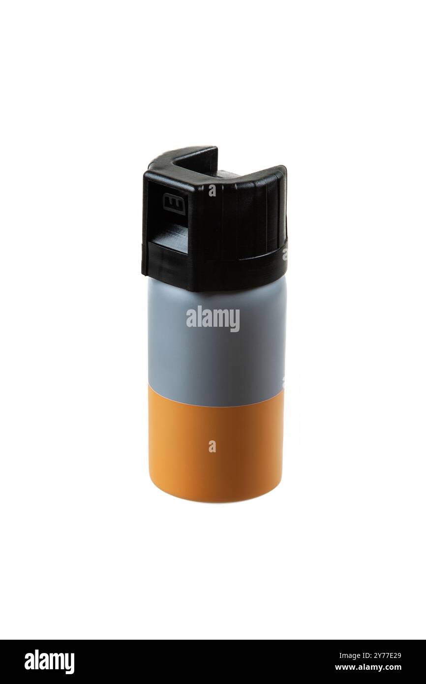 Compact pepper spray canister with safety cap on white background Stock ...