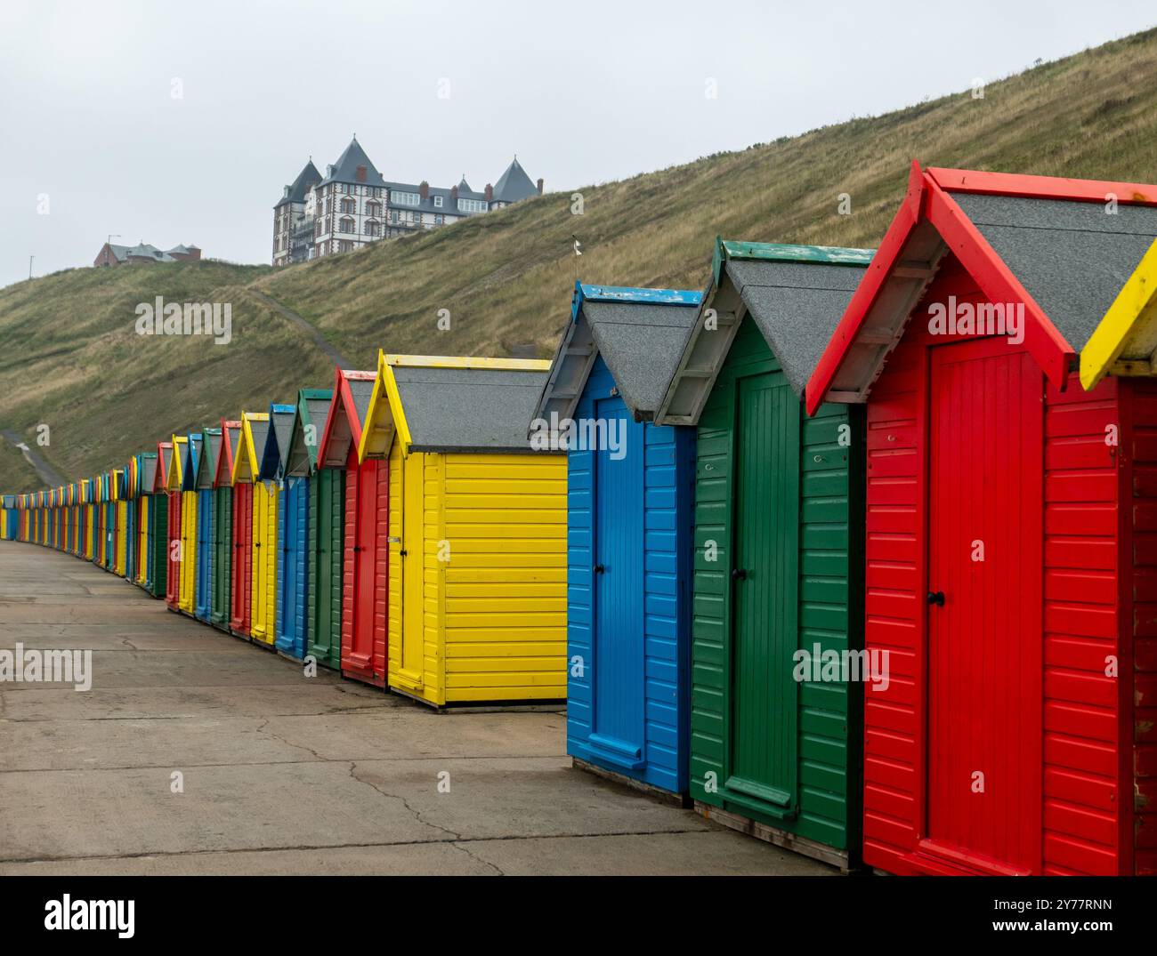 Colourful beach huts on Whitby promenade Stock Photo - Alamy