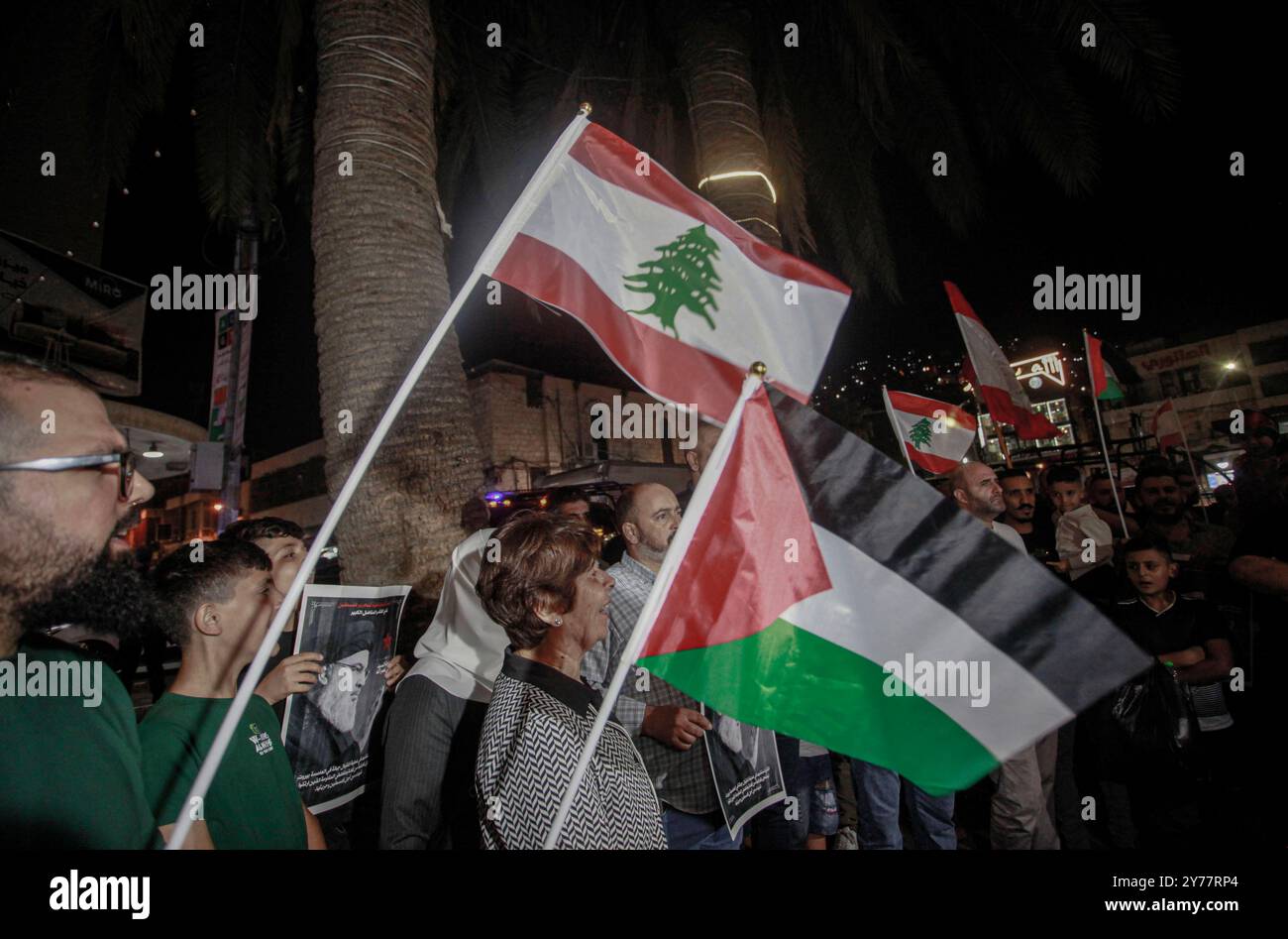 Palestinians hold flags of South Africa, Lebanon, Yemen and Palestine ...