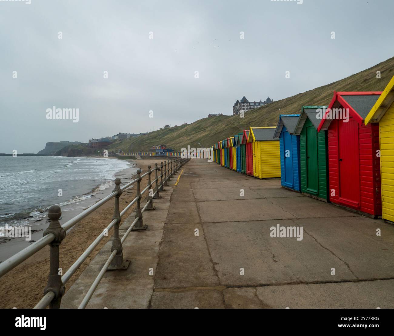 Colourful beach huts on Whitby promenade Stock Photo - Alamy