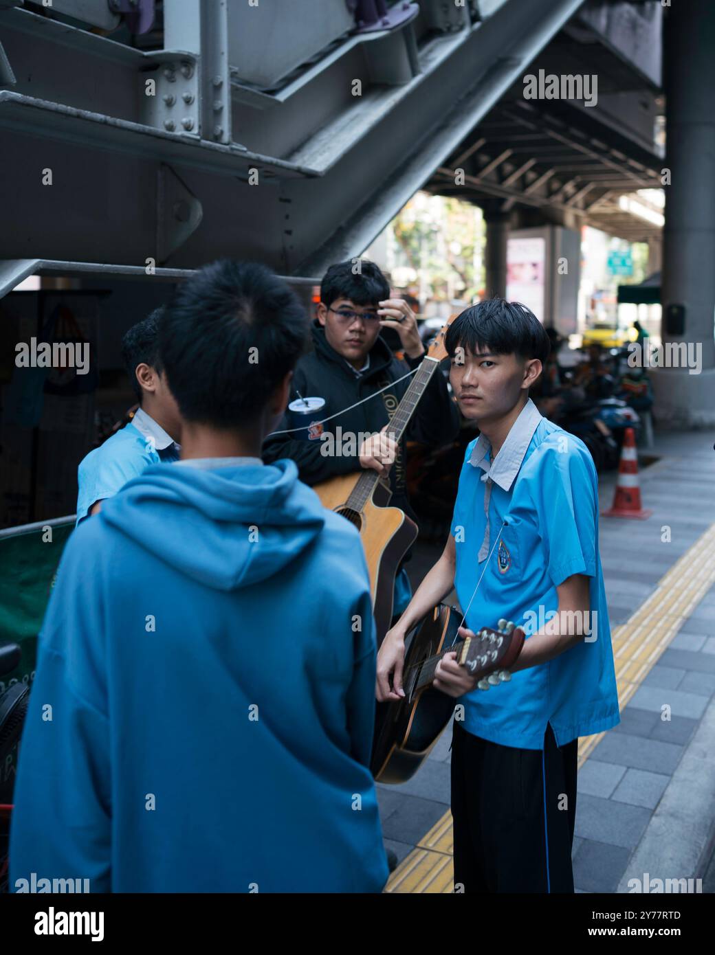 Bangkok, Thailand - February 14th, 2024: Young Thai men playing music ...