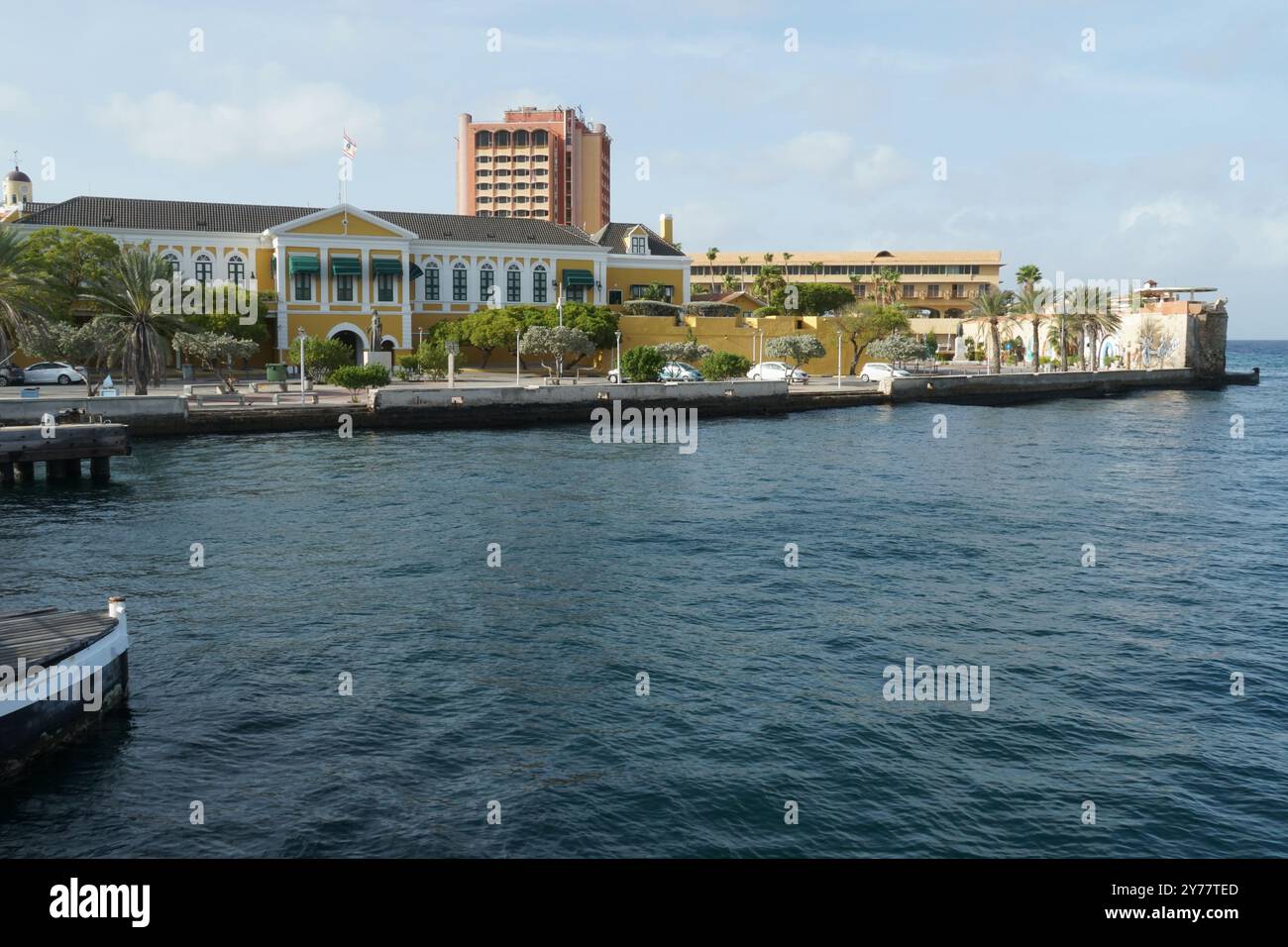 Yellow building of Governor's Palace and Waterfort Plaza on berth of ...